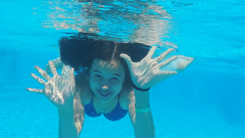 Beauty Young Woman Swimming Underwater In Swimming Pool Underwater
