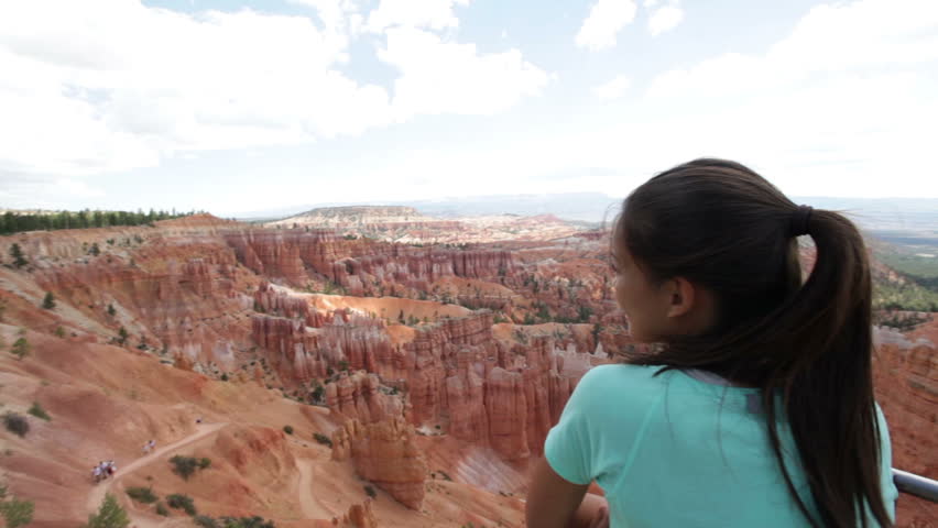 Hiker Woman In Bryce Canyon Hiking Looking And Enjoying View During Her Hike Wearing Hikers