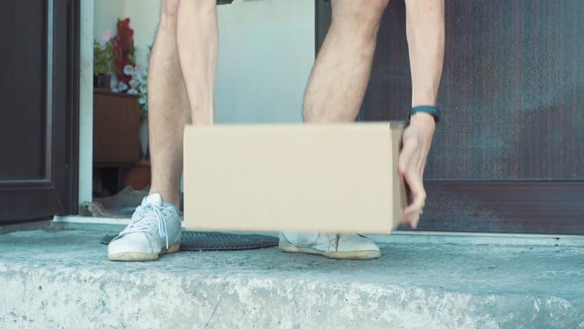 A Man Picks up a Stock Footage Video (100% Royalty-free) 1012307339 ...