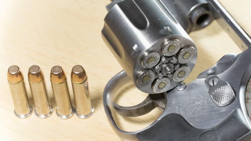 Close Up Of A Loaded Revolver With Open Cylinder Showing The Bullets In ...