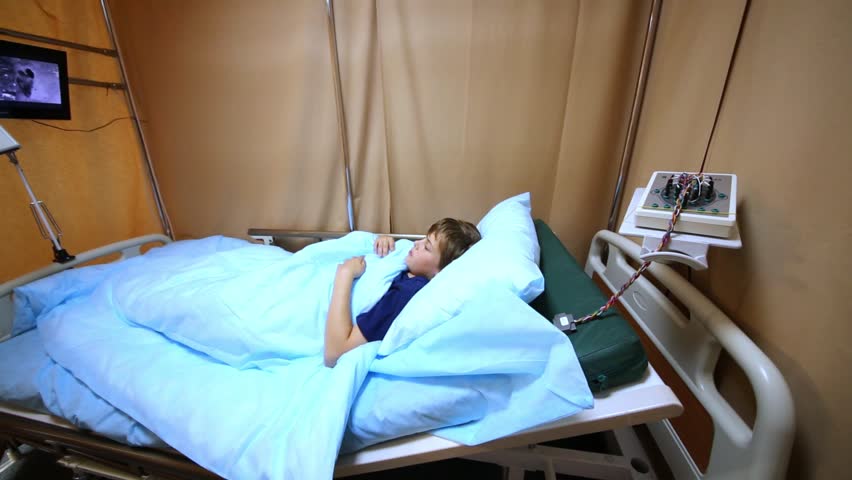 Hospital Ward, Boy Lies On Bed And Female Health Worker With Syringe ...