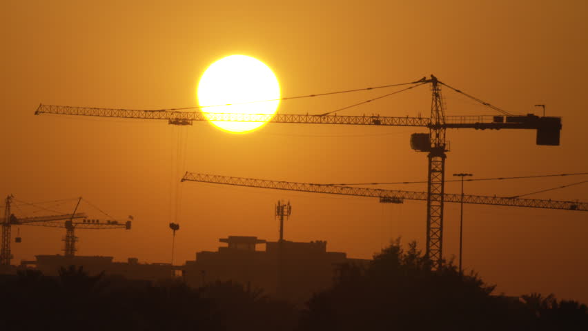 Sun Setting Behind Construction Cranes Stock Footage Video (100% ...