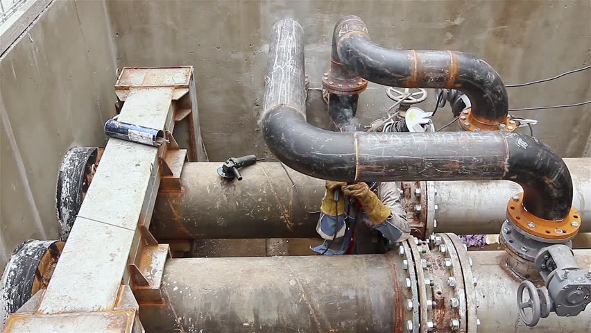 Manhole, Metalworker Is Preparing Pipeline Node For Welding. Metal ...