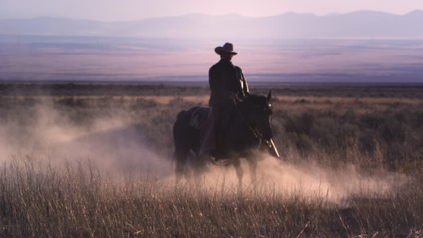 Slow Motion Shot Of A Cowboy Riding A Horse. This Shot Was Taken At ...
