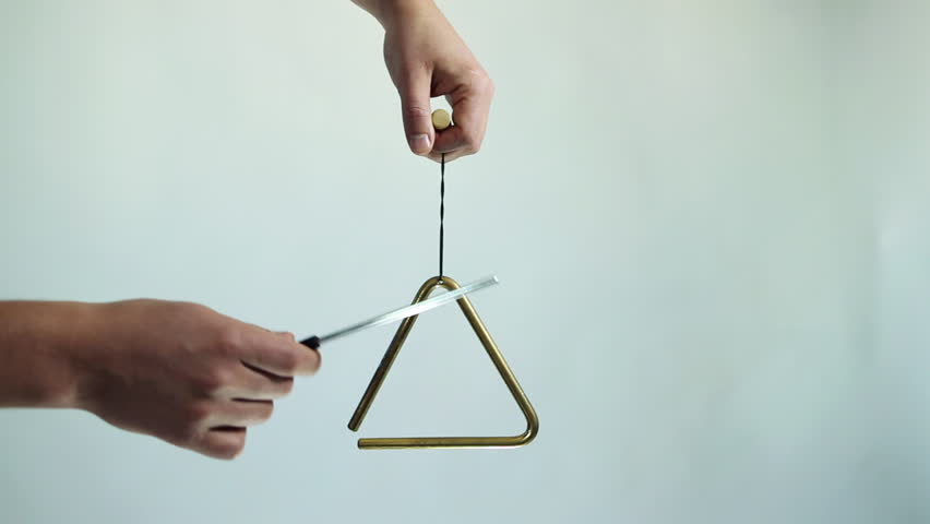 Hands Play a Musical Triangle. Stock Footage Video (100% Royalty-free ...