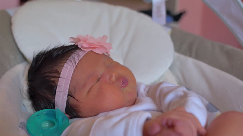 Stock video of a newborn baby wiggling around in | 12809729 | Shutterstock