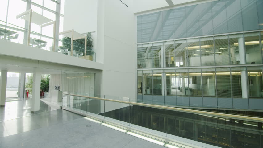 Interior View Of Modern Office Building With Glass Partitions & Central ...