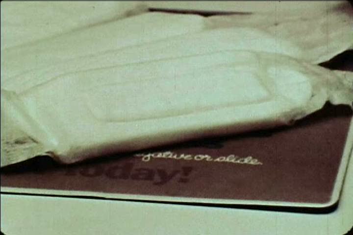 CIRCA 1960s - A Mother Teaches Her Young Daughter How To Use A Sanitary ...