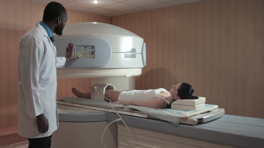 Ending Of Knee-joint Mri Scanning. Female Patient On Automatic Mri ...