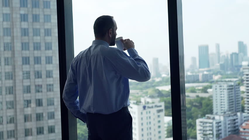 Young Businessman Drinking Coffee and Stock Footage Video (100% Royalty ... Young Businessman Drinking Coffee and Stock Footage Video (100% Royalty ...
