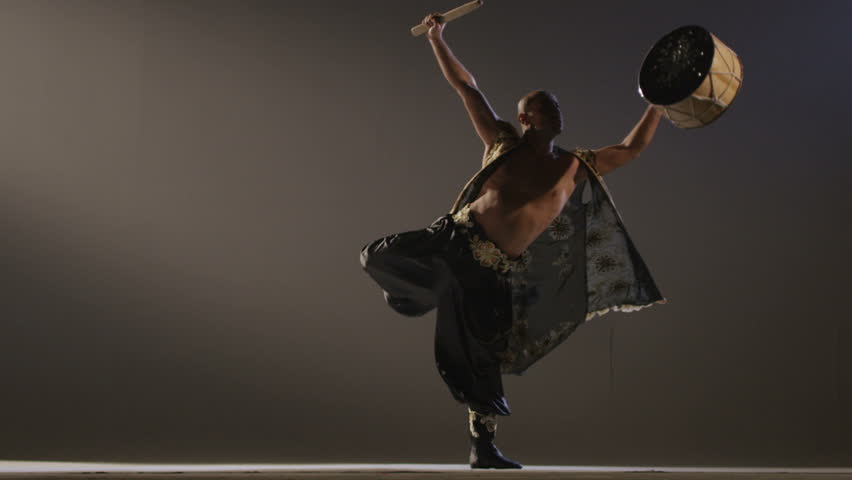 Shaman Dancing With A Drum On Grey Background. Ethnic Asian Dance. Shot ...