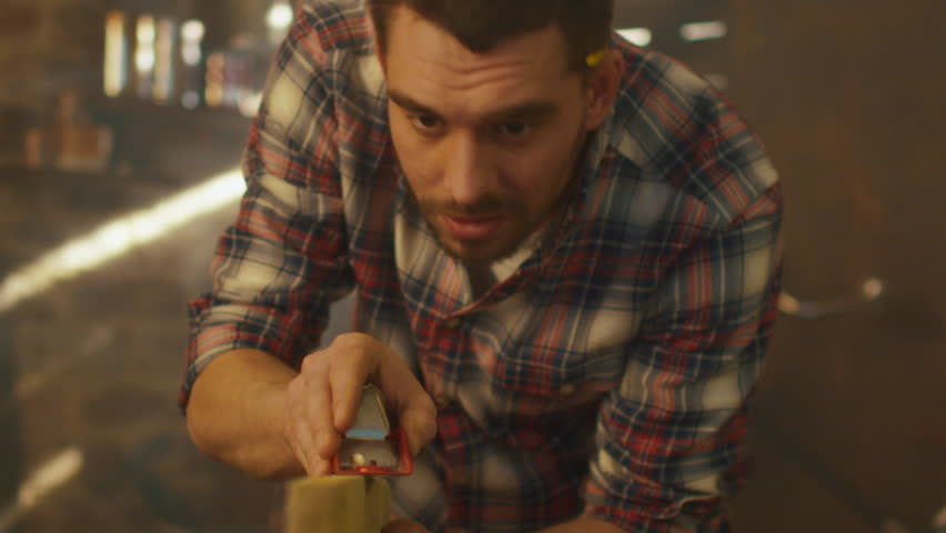 Young Man is Woodworking in Stock Footage Video (100% Royalty-free ...