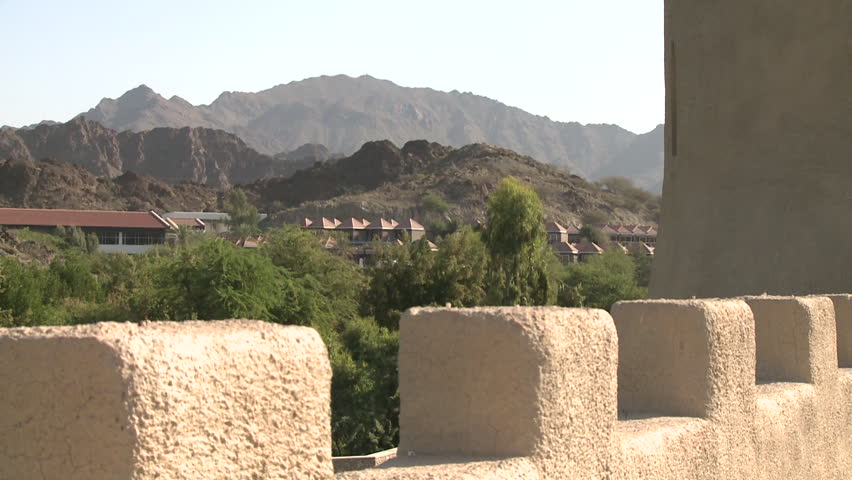 Hatta, Dubai. Tilt Down From Sky To The Hatta Fort Hotel With The Hajar ...