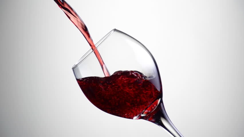 Glass Of Red Wine Falling And Splashing Against White Background, Slow ...