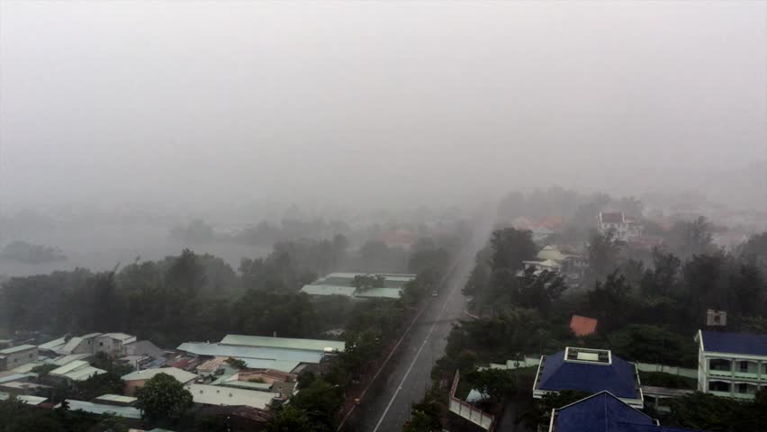 Stock video of heavy rain in tropical city. high | 23064859 | Shutterstock
