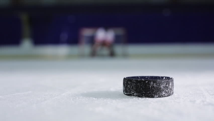Close-up Of Hockey Puck Being Struck By Hockey Player In Slow Motion ...