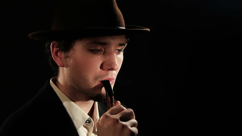 Stock video of a young man smoking a pipe | 2375639 | Shutterstock
