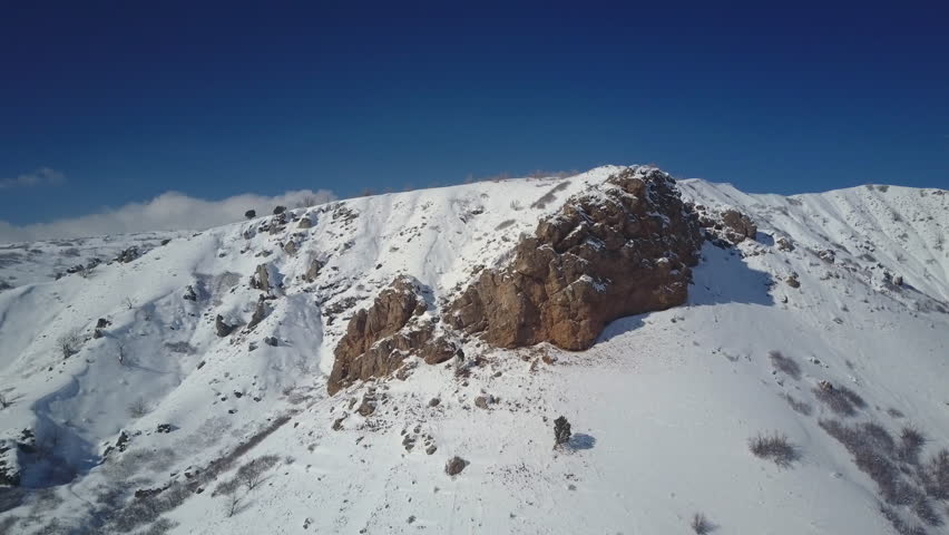 Aerial Climb Rocky Mountain Ridge Winter Snow Utah. Winter Snow On ...