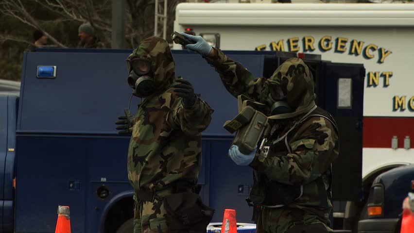 HAZMAT Team Members Wearing Protective Suits To Protect Them From ...