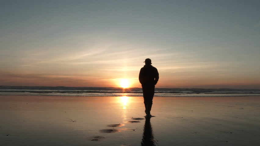 Young Man Praising And Worshiping God During Sunset By The Sea Stock ...