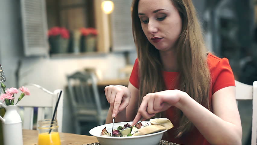 Pretty Girl Eating Delicious Lunch And Drinking Orange Juice, Steadycam ...