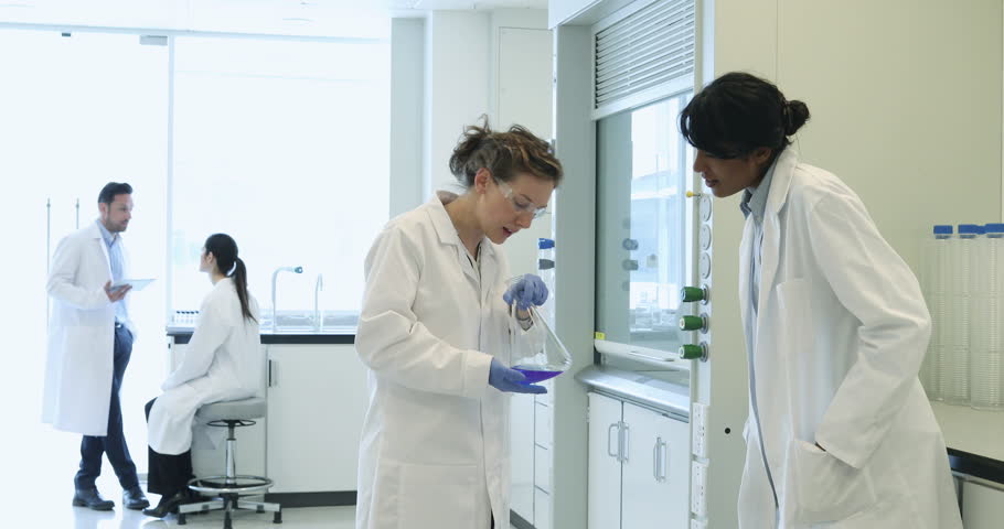 4K Scientific Research Engineers Working In Lab With Computer And 3D ...