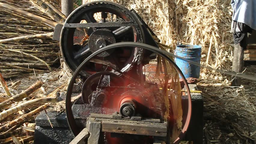 Stock video of small sugar cane mill producing panela | 26536559 ...