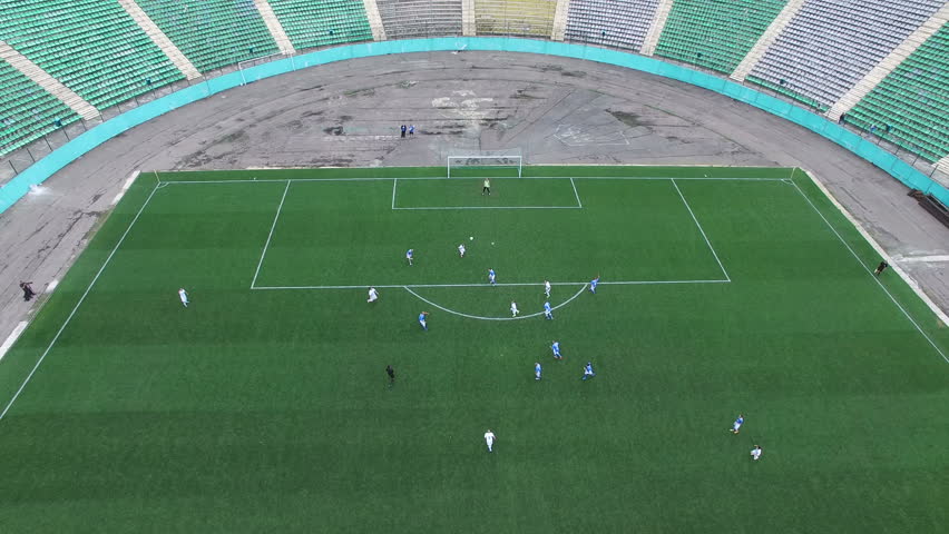 4k Aerial Movie Of Footballer Playing Football On The Football Field ...