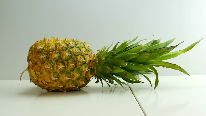 Pineapple Spinning Slowly On White Background Stock Footage Video ...