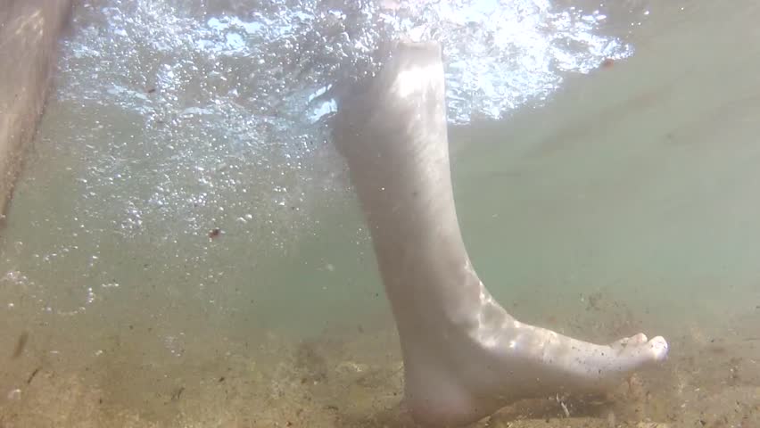 Underwater Shot Of Feet Walking On The Bottom Of The Ocean Stock ...
