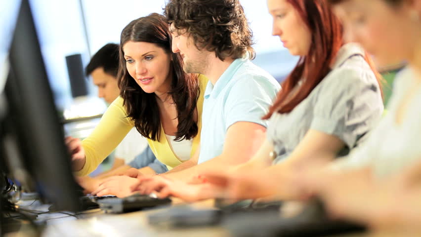 Multi Ethnic Graduate College Friends And Female Lecturer Researching ...