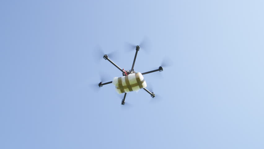 CLOSE UP: Drone Delivery Of Illegal Drugs. UAV Aircraft Flying Drug ...