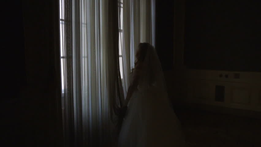 Stock video of woman quickly throw up curtains and | 33465679 ...