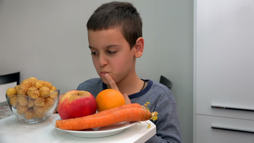 Little Boy Choosing Healthy Over Junk Food Stock Footage Video 34995316 ...