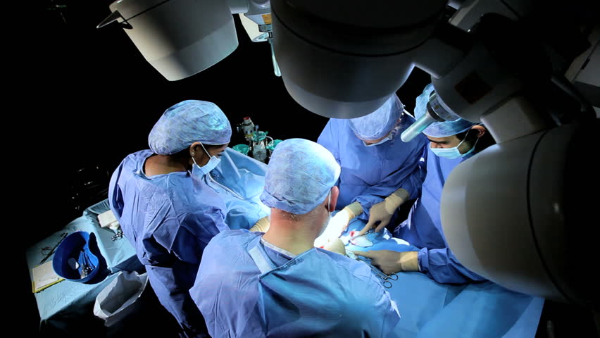 Stock video of overhead view multi ethnic surgical team | 3781979 ...