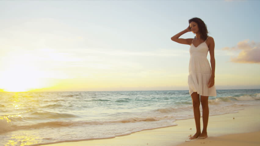 Pretty Girl In Sundress Reveling Being Alone By Ocean At Sunrise On ...