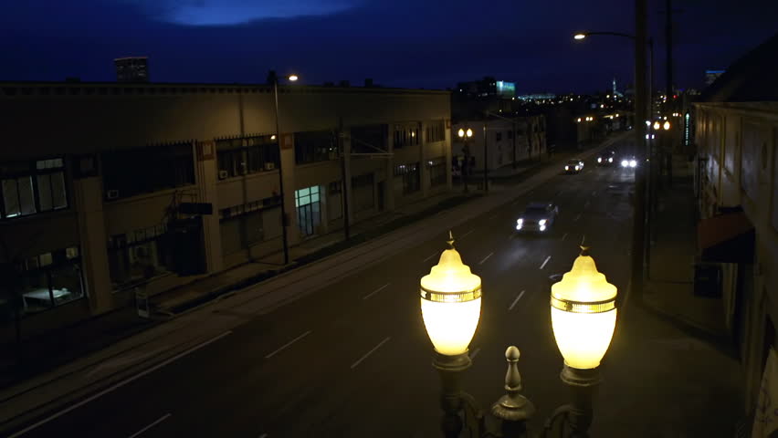 PORTLAND, OR - 2013 - Cars Drive Down A One-way Street At Night In ...