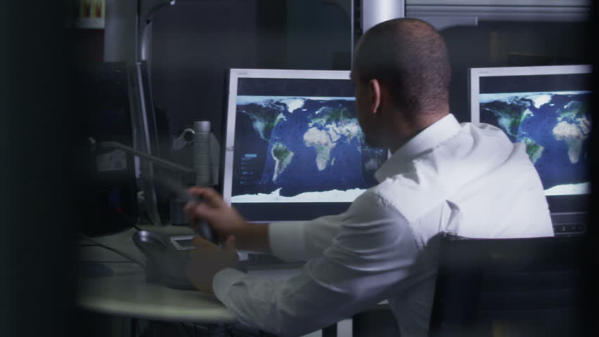 A Busy Team Of Security Personnel Are Manning The Stations Within A ...