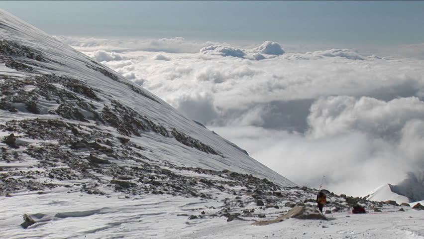Climbers Walking In The Distance With Mt. Everest Pinnacles And Summit ...