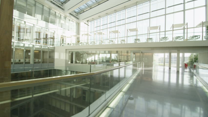 Interior View Of Modern Office Building With Glass Partitions & Central ...