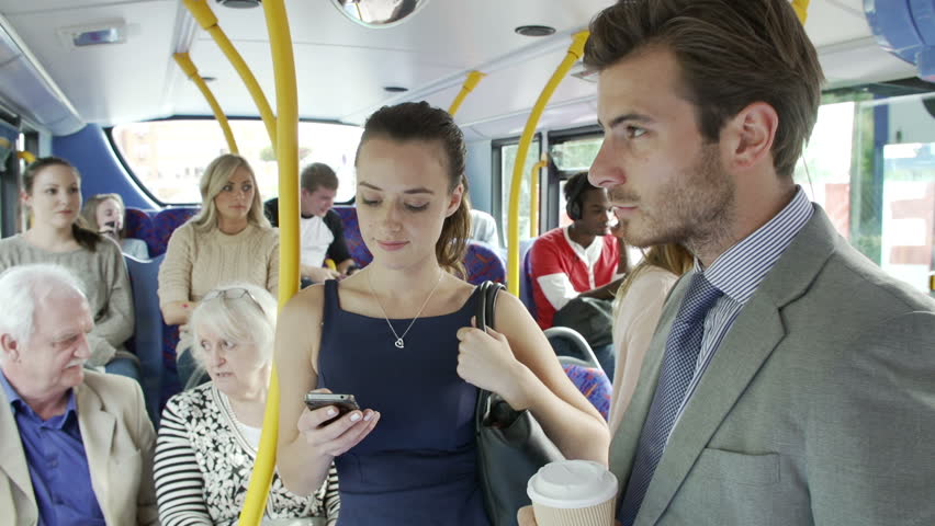 Interior Of Crowded Bus With Passengers Listening To Music And Using ...