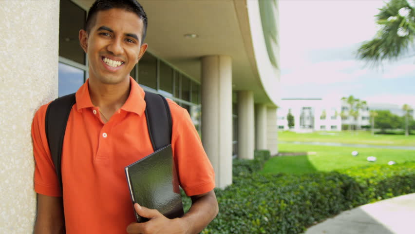 Confident Asian Indian Teenage Male Student Standing Outside Modern ...