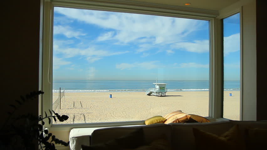 House Beach Window. A Beautiful View Of The Beach Sits Out Front Of The ...