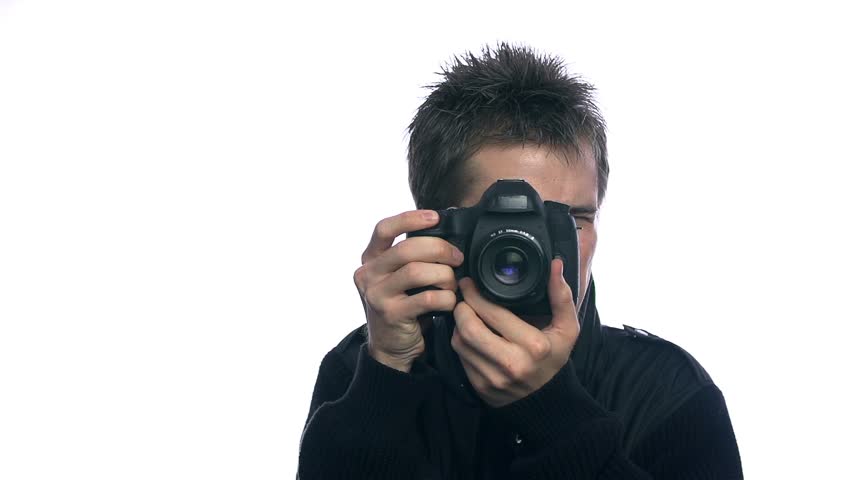 Photographer Directing While Taking Pictures In Studio With SLR And ...
