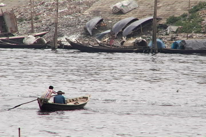 A Logging Boom Boat Is Moored Alongside A Fast Moving River/Boom Boat/A ...