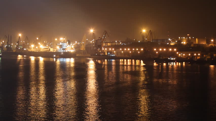 Night Lights Illuminate The Seaport And Cargo Ship Filmati e video d ...