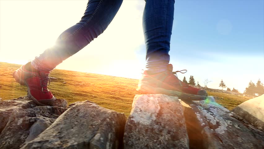 Female Hiker Walking On Rough Terrain. Foot Steps In Slow Motion ...