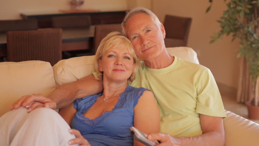 Grandparents Waving To Someone Upstairs In Living Room 4K. Grandma And ...
