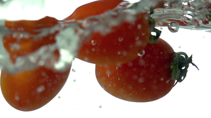 Small Tomatoes Falling Into Water. Stock Footage Video (100% Royalty ...