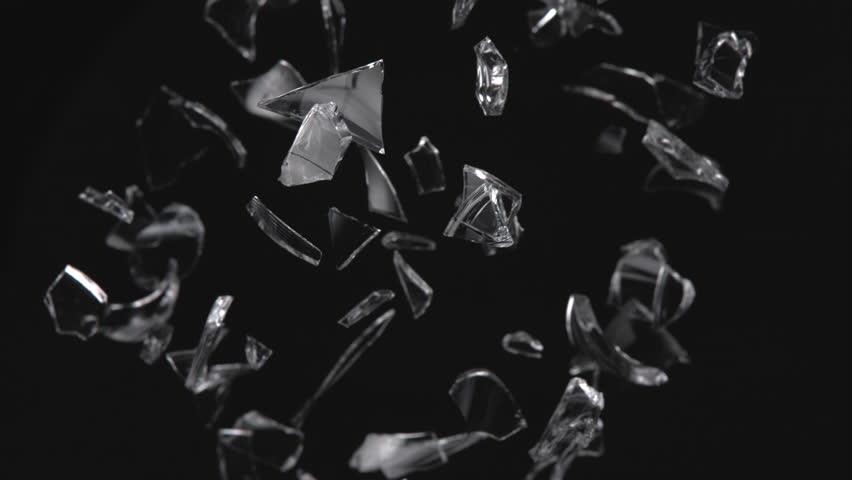 Camera Follows Broken Glasses Exploding Against Black Background. Shot ...
